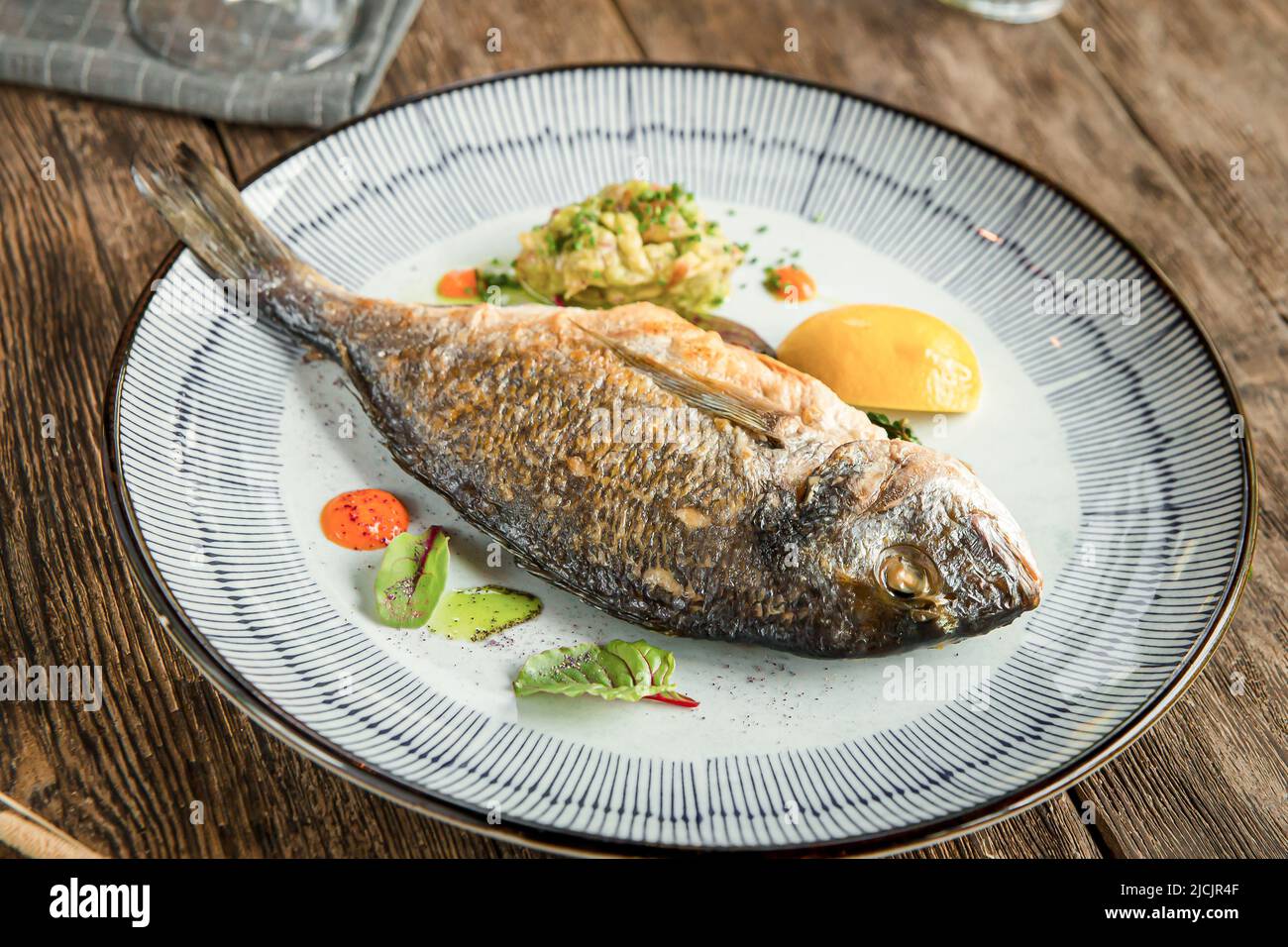 Whole cooked fish plate hi-res stock photography and images - Alamy