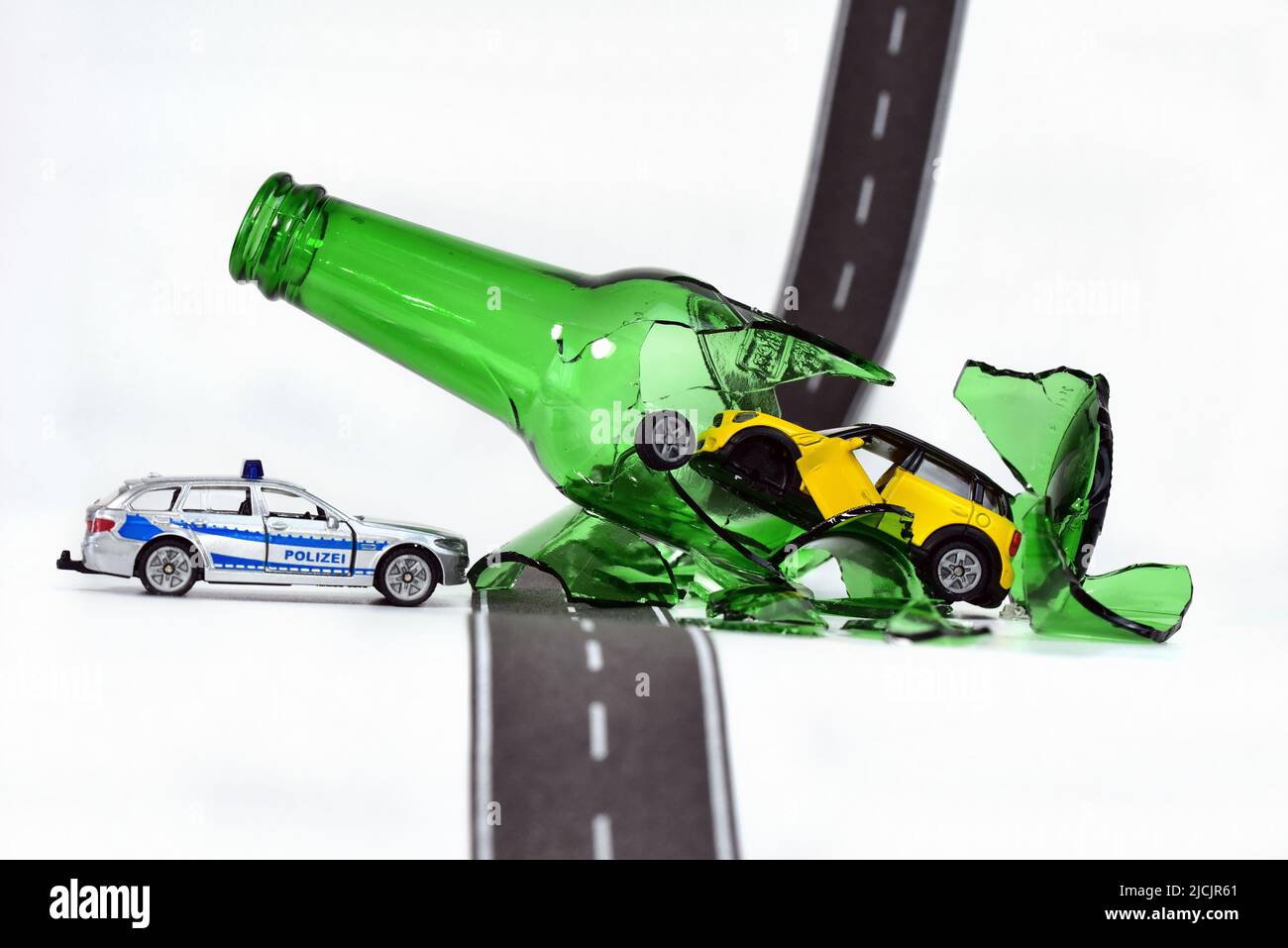 toy car accident with beer bottle and police car Stock Photo - Alamy