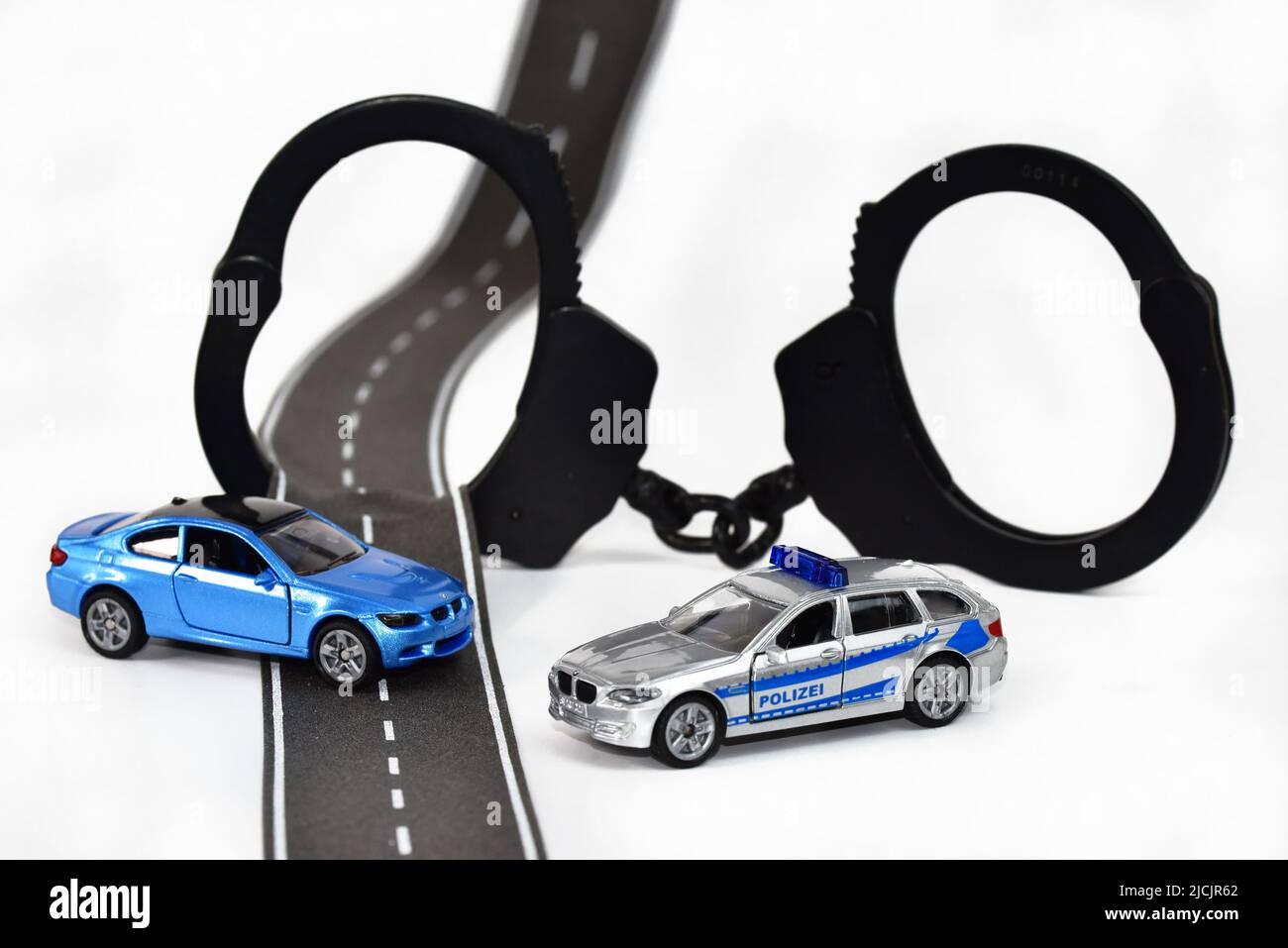 police toy car with handcuffs Stock Photo - Alamy