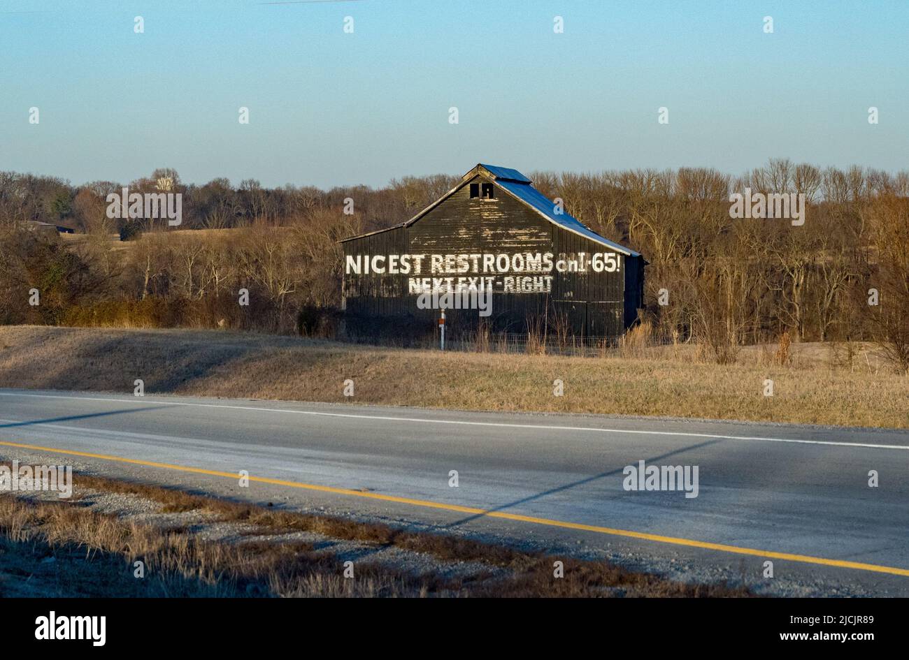 Painted barn restroom advertisement on interstate 65 Stock Photo - Alamy