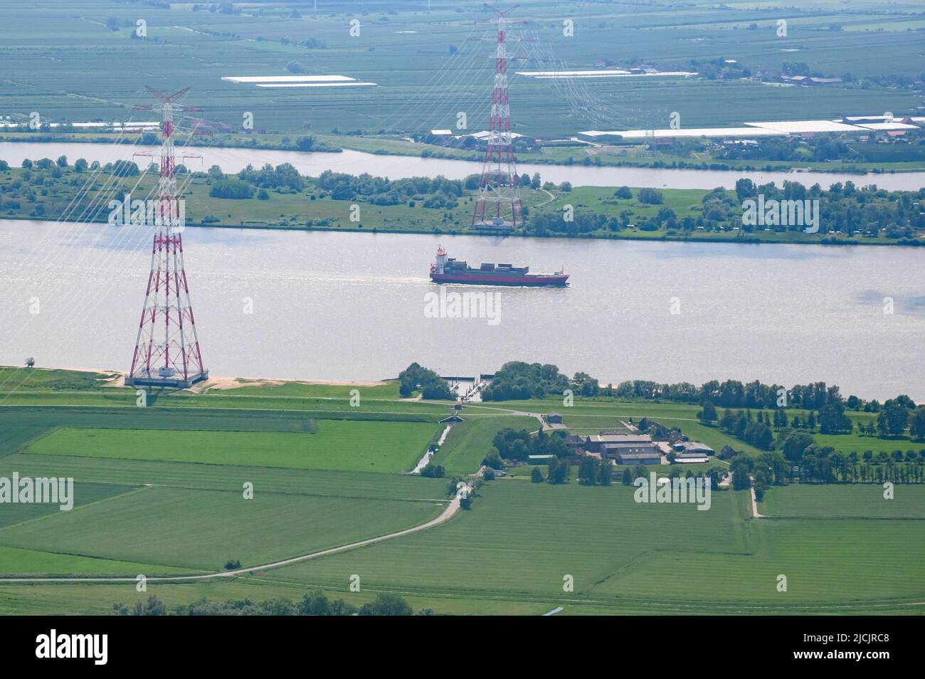 Hetlinger Schanze, Germany. 09th June, 2022. A container ship sails ...