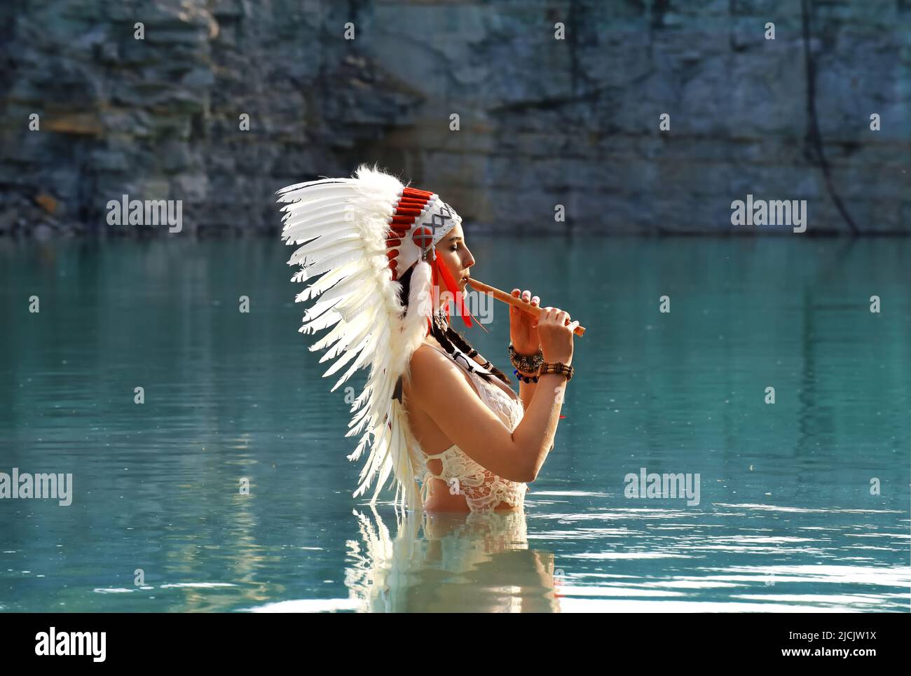 Young woman playing flute hi-res stock photography and images - Alamy
