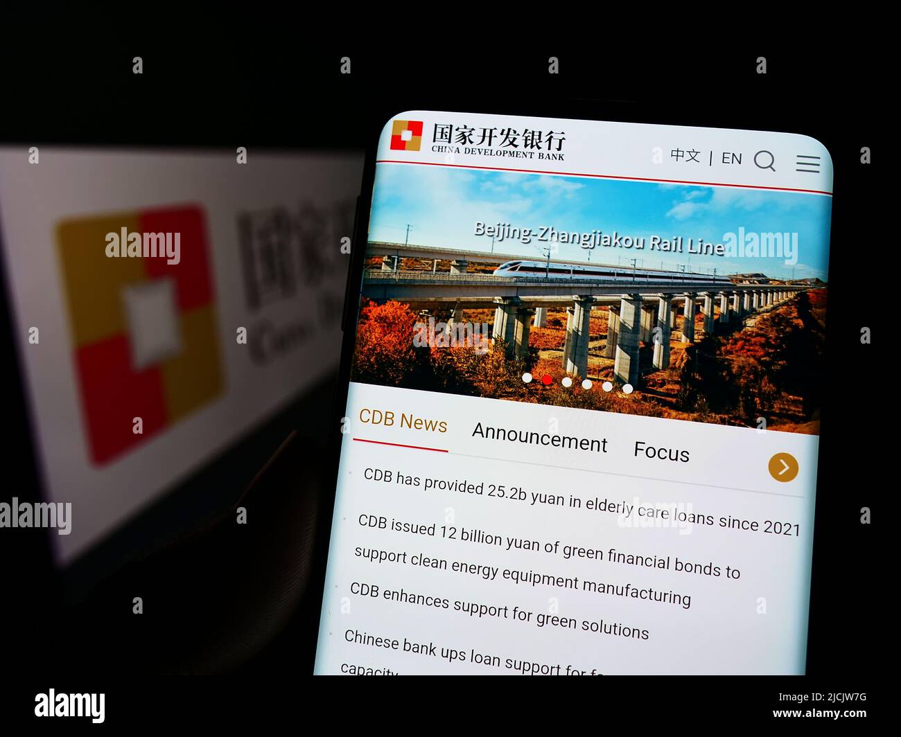 Person holding smartphone with logo of China Development Bank (CDB) on ...