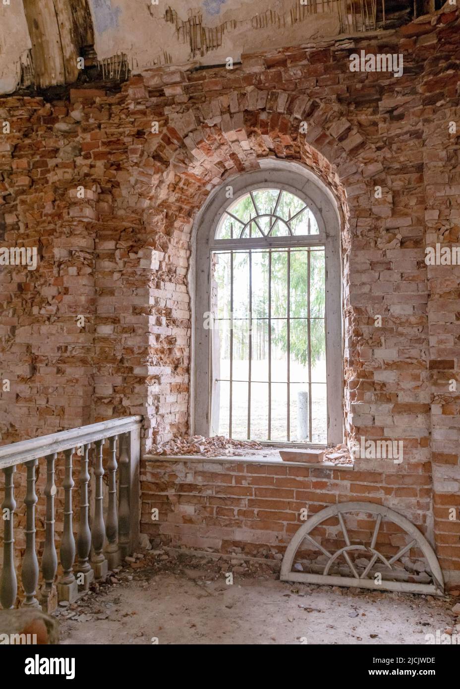 photo with old arched windows in an abandoned church, iron grilles in ...