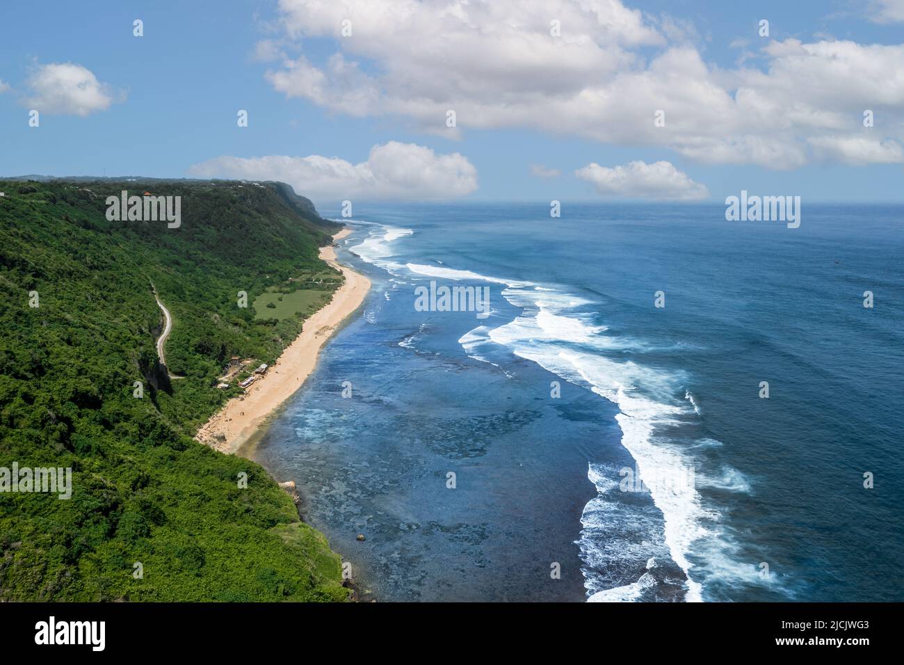 aerial of Nyang Nyang beach in Uluwatu Bali Indonesia on a sunny day as ...
