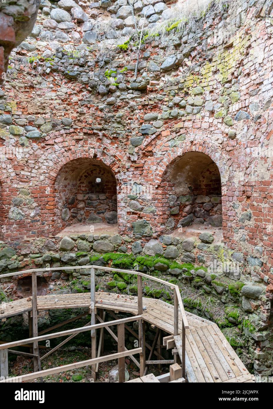 early spring landscape, red brick and boulder ruins, ruined stone ...