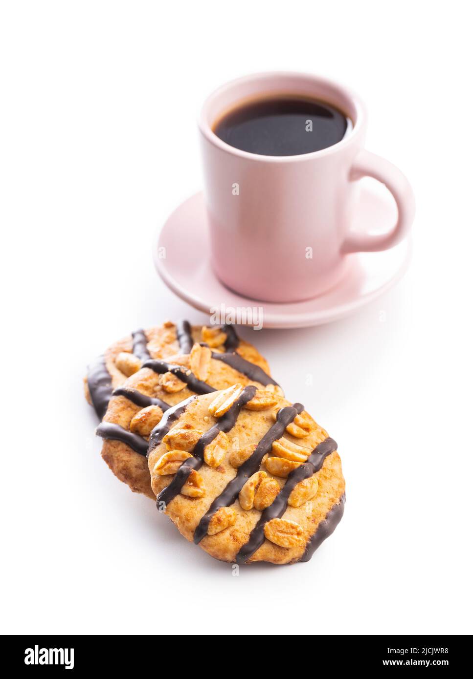 Chip cookies with peanuts and chocolate strips and coffee cup isolated ...