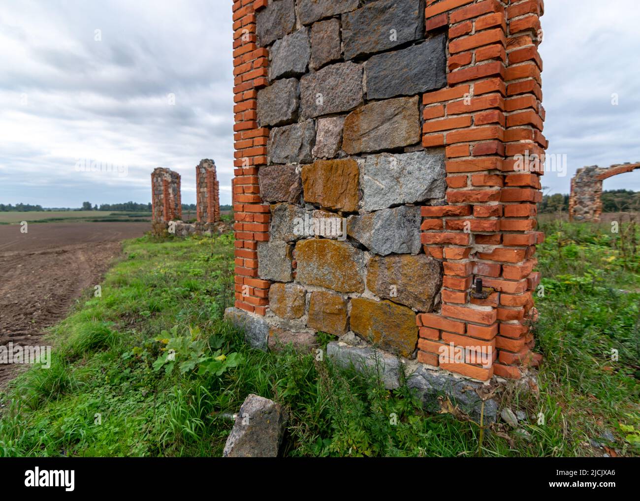 landscape with stone and brick barn ruins, old stone foundations ...