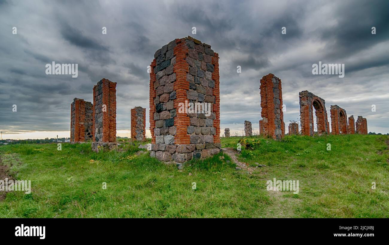 landscape with stone and brick barn ruins reminiscent of one of the ...