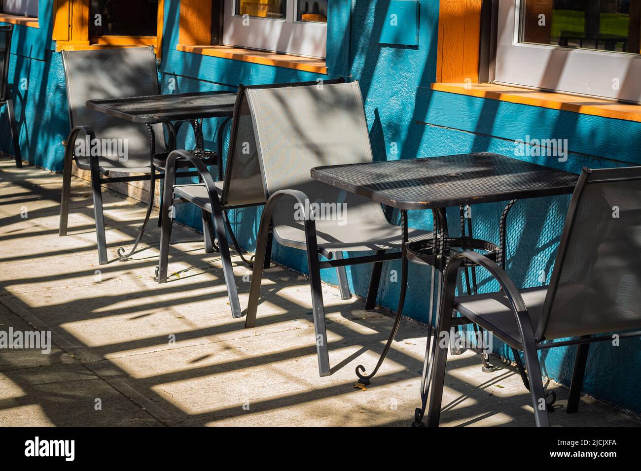 Empty restaurant summer terrace with tables and chairs. Cafe terrace on ...