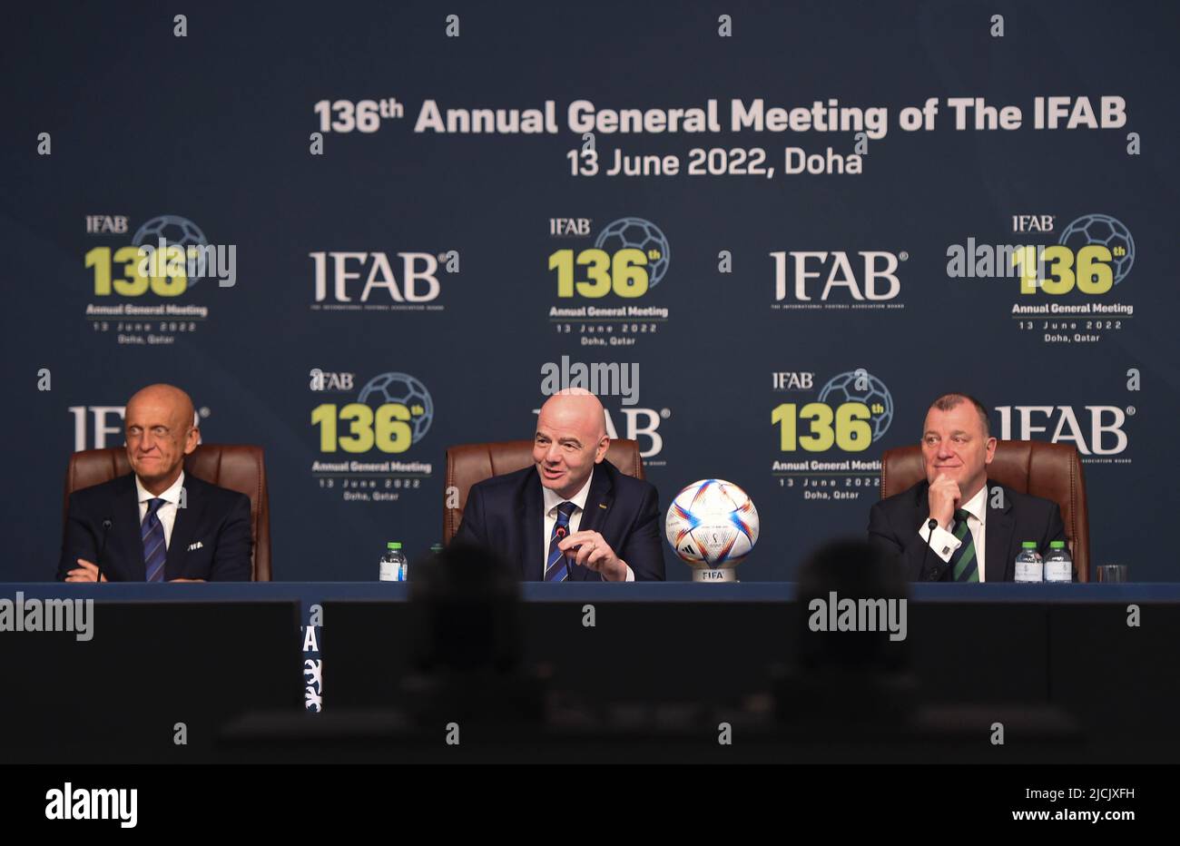 Doha, Qatar. 13th June, 2022. FIFA President Gianni Infantino (C) and ...