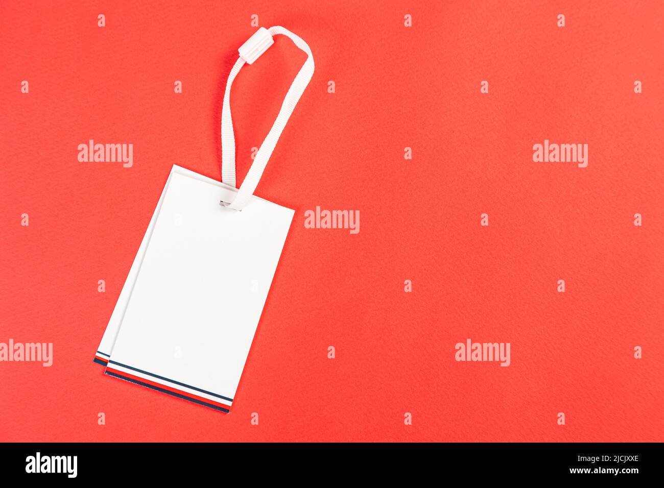 white price tag on a red background, price tag for goods Stock Photo ...