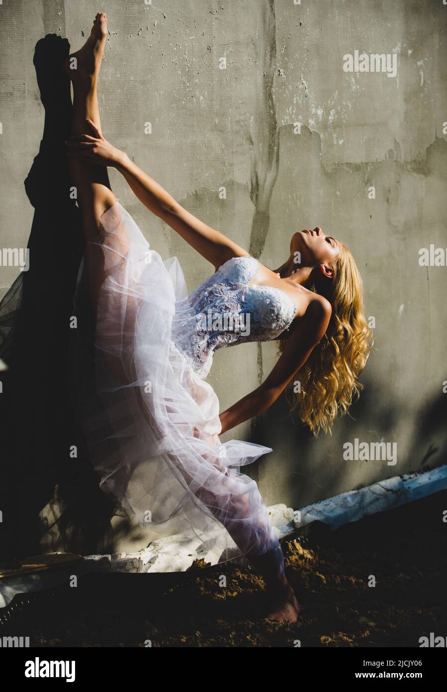 Art ballet. Leg-split, flexible girl doing split. Fitness sport woman ...