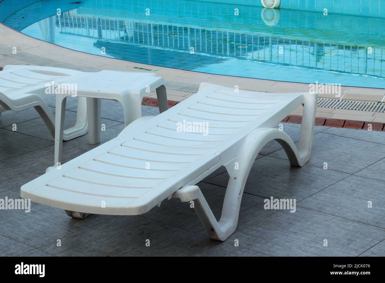 Plastic chairs pool hi-res stock photography and images - Alamy