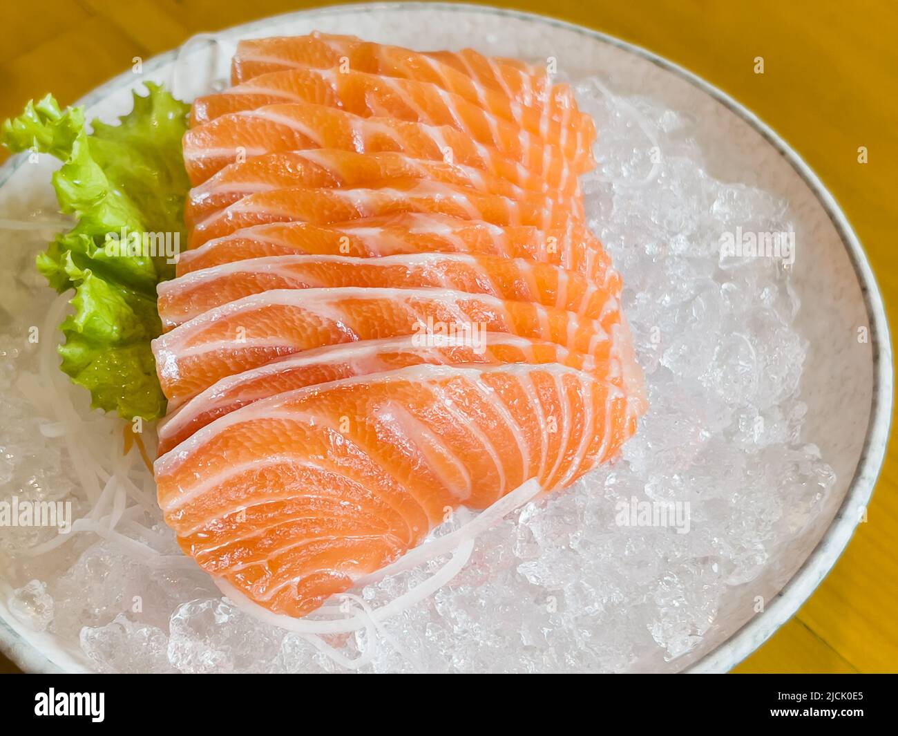 Salmon sashimi slice fresh serve on ice, Japanese style Stock Photo - Alamy