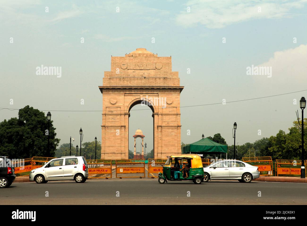 The India Gate, photographed in a foreground of road traffic in New ...