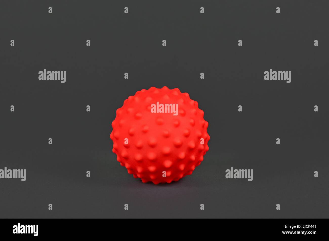 Red circular viral hepatitis model on black background Stock Photo - Alamy