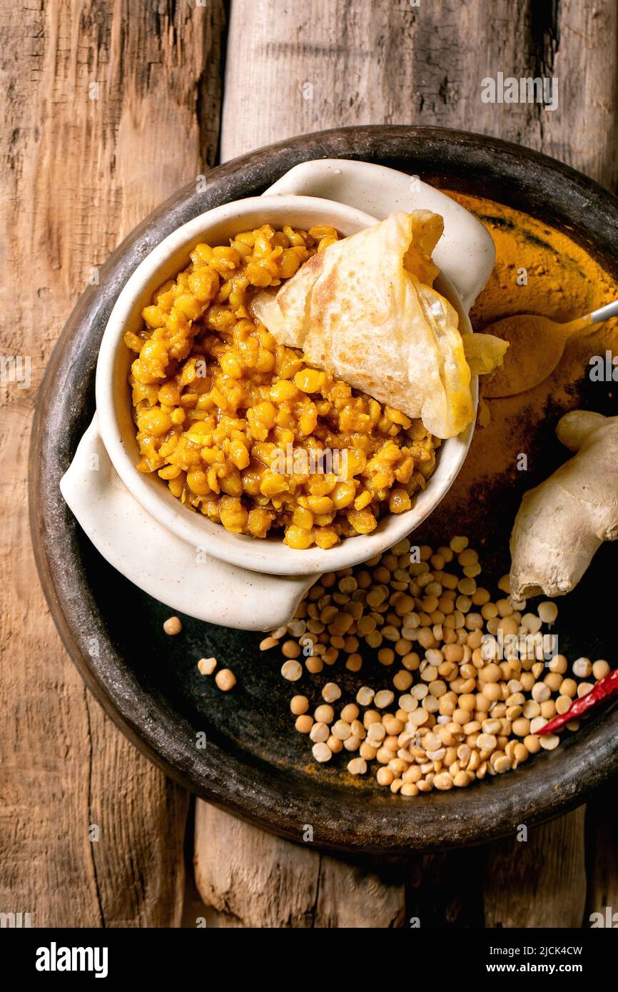 Vegetarian dhal with roti bread. Traditional indian vegan yellow pea ...