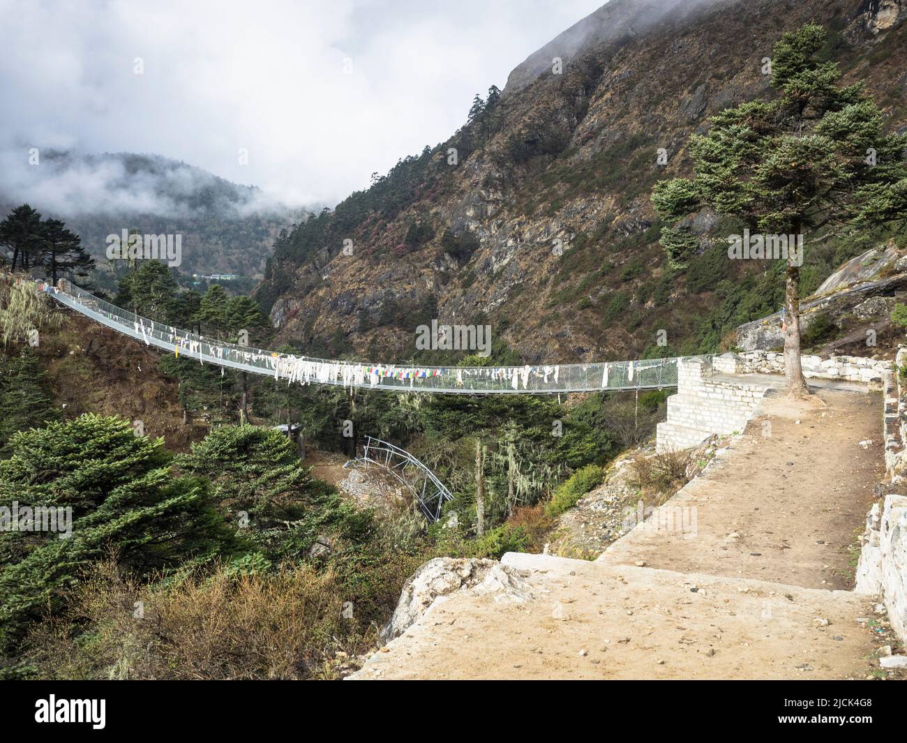 New and old (destroyed) bridges over the Imja Khola below Pangboche ...