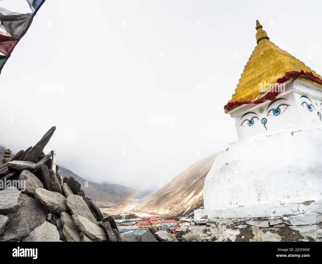 Stupa and mani wall above Dingboche (4410m) with a rainbow over the ...