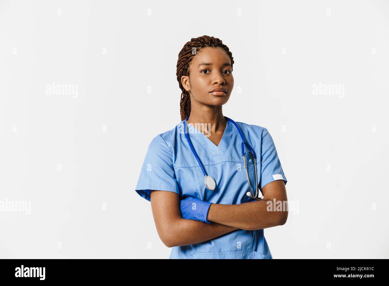 Young black doctor wearing uniform posing with stethoscope isolated ...