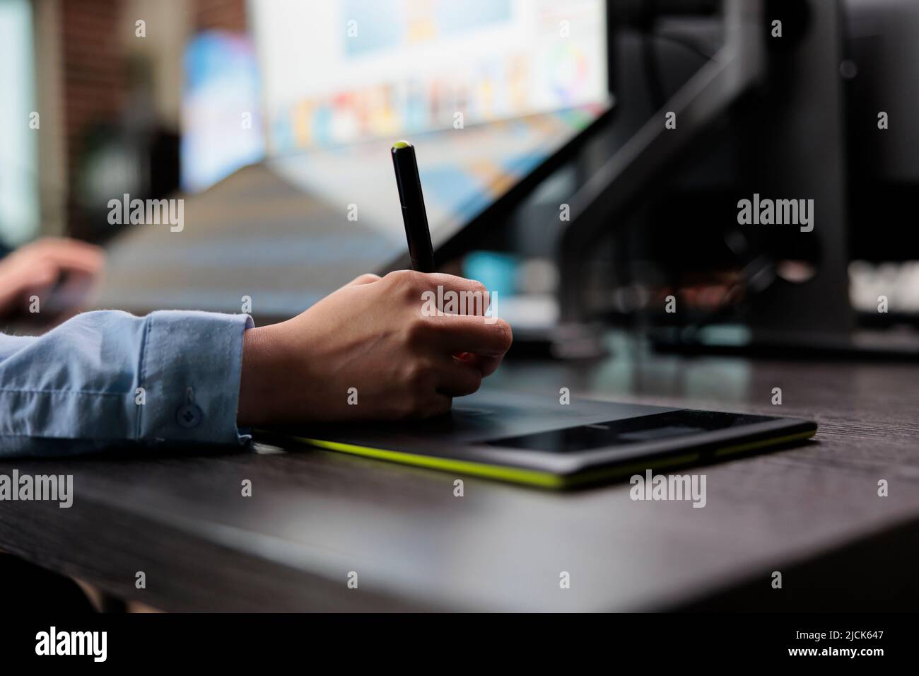 Closeup of creative graphic designer using stylus pen and graphic ...