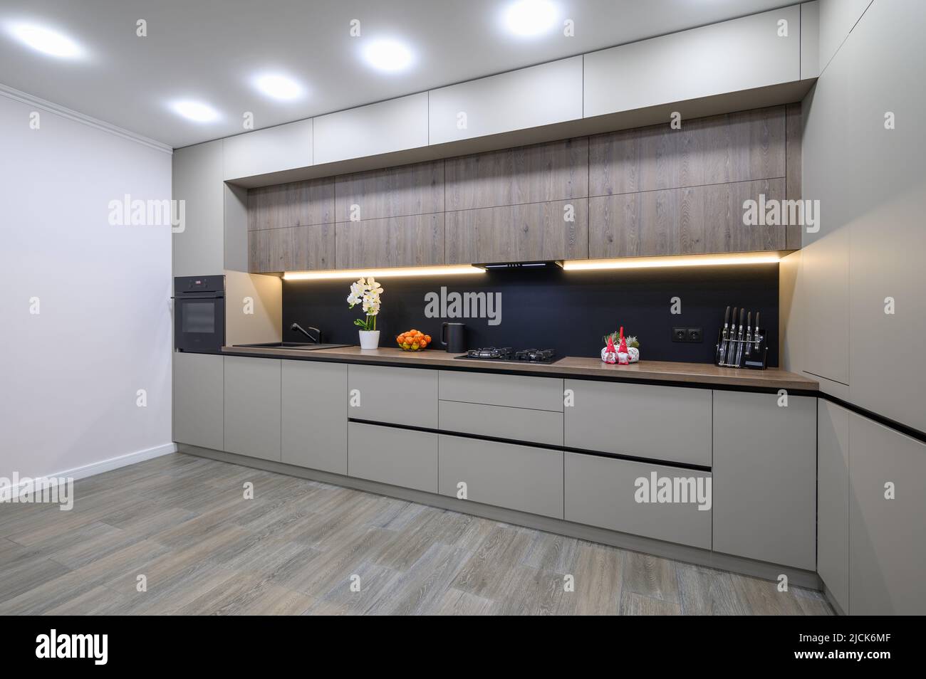 Trendy grey modern kitchen interior with minimalistic furniture Stock ...