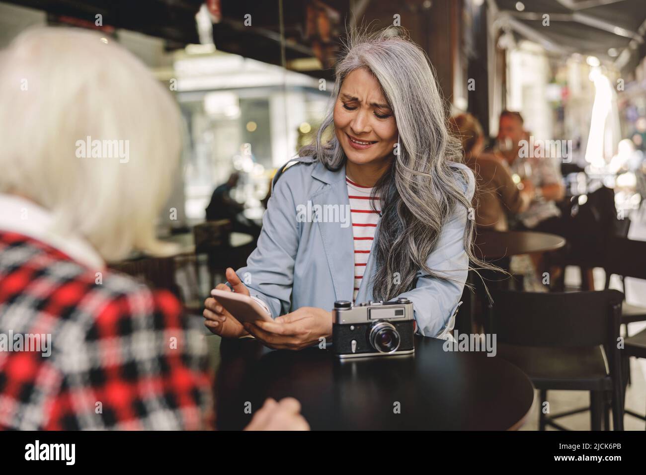 Urban women during coffee time in cafe Stock Photo - Alamy