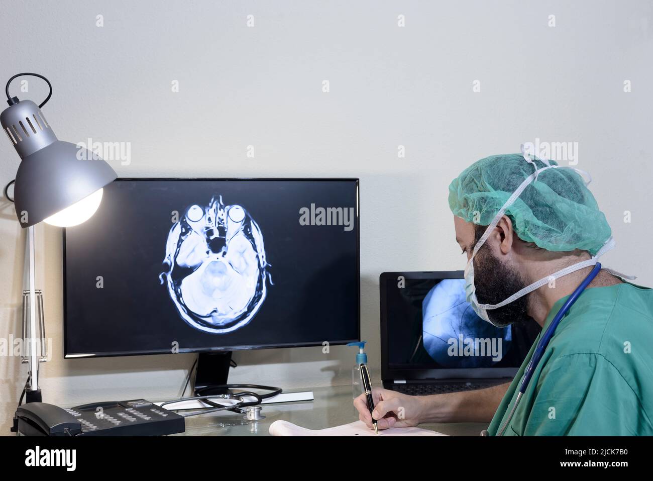 In the medical laboratory, the patient undergoes an MRI or CT scan ...