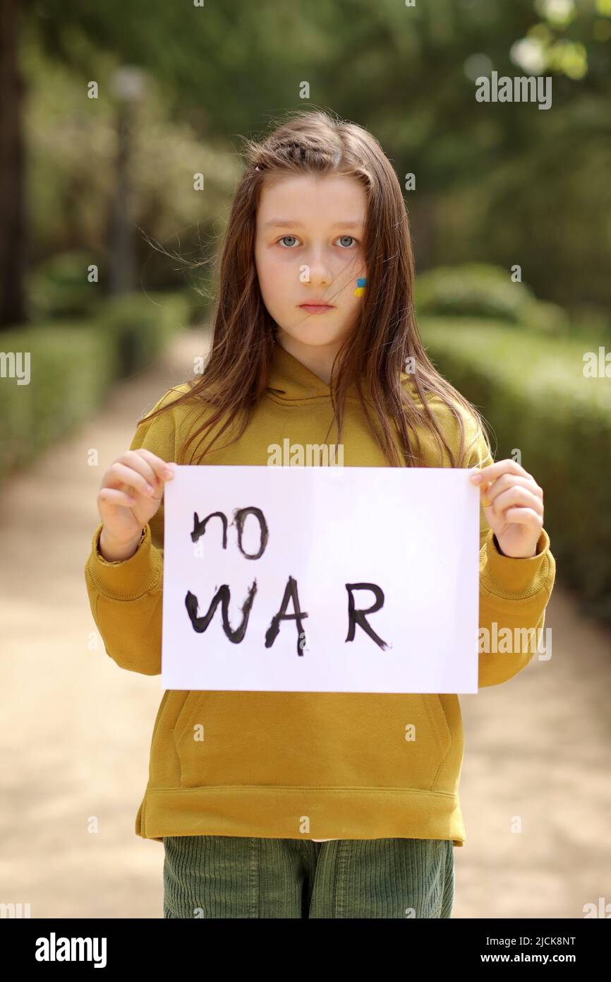 Upset Ukrainian poor toddler girl kid homeless protesting war conflict ...