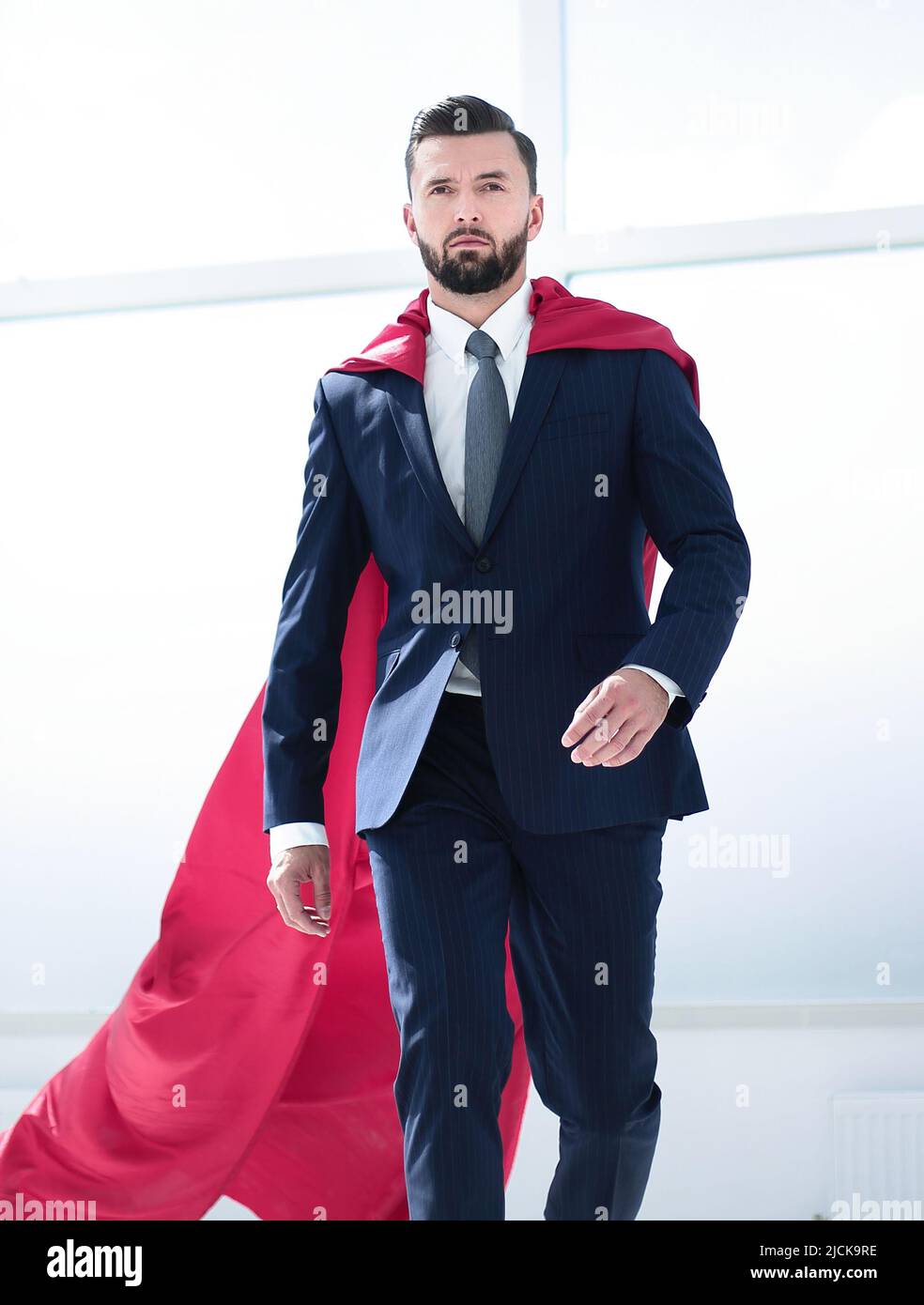 Businessman in a red superhero cloak Stock Photo - Alamy