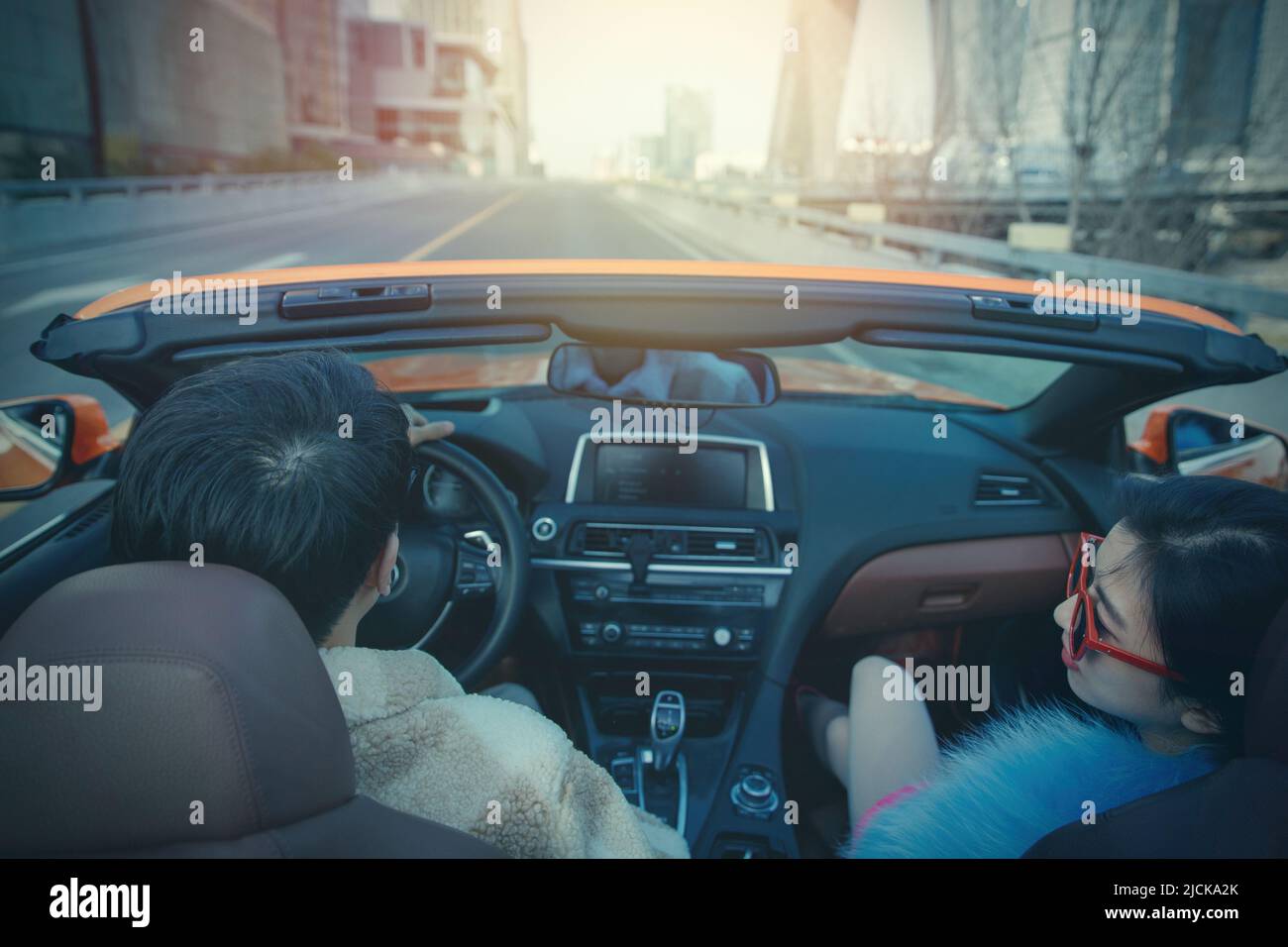 Fashionable young couples driving car for a ride Stock Photo - Alamy