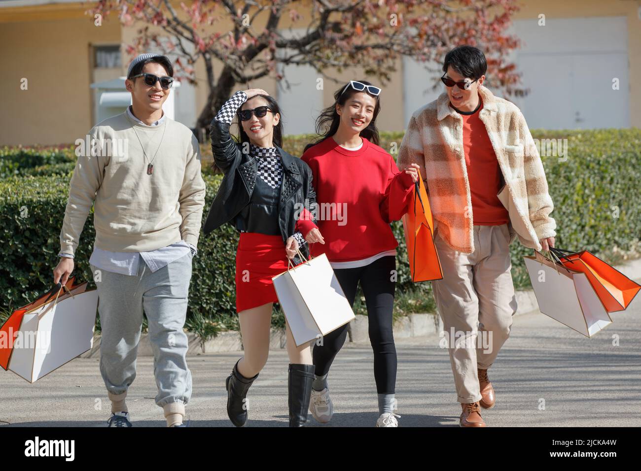 Happy fashionable young people go shopping Stock Photo - Alamy
