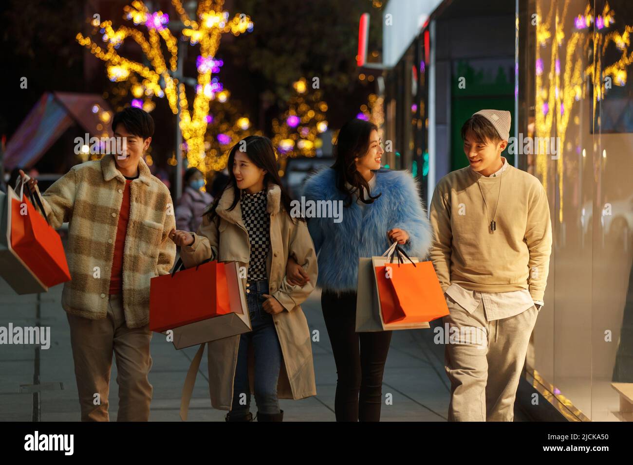 Happy fashionable young people go shopping Stock Photo - Alamy