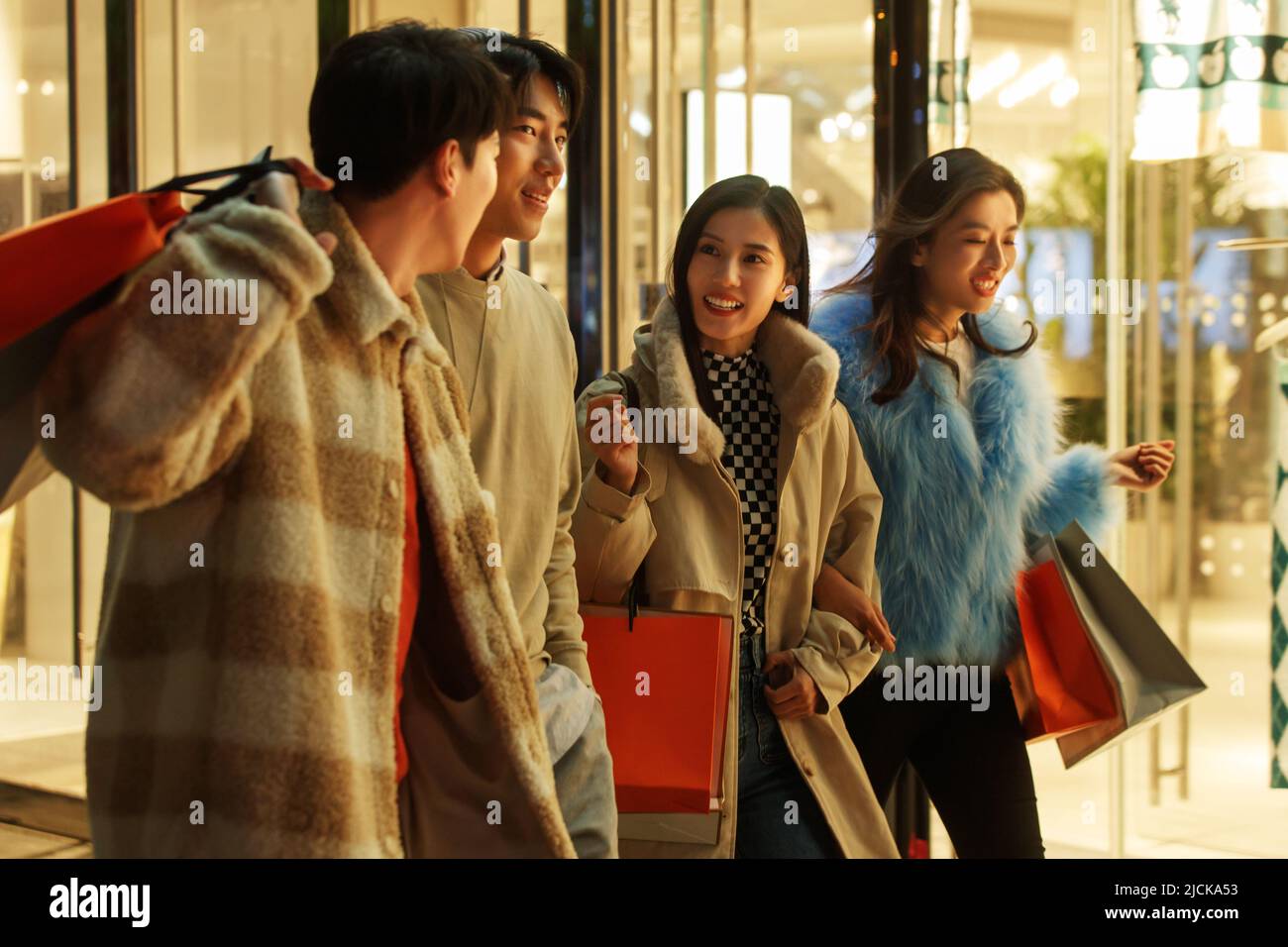 Happy fashionable young people go shopping Stock Photo - Alamy