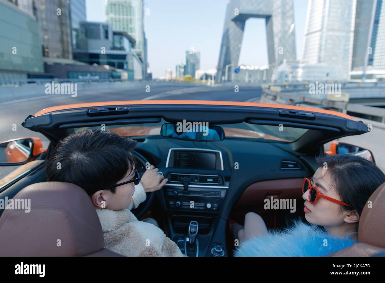 Fashionable young couples driving car for a ride Stock Photo - Alamy