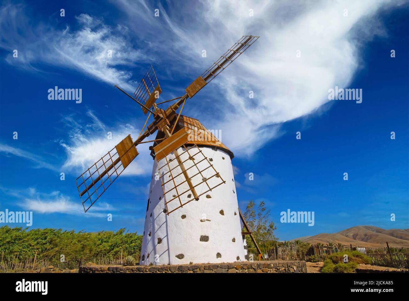 One beautiful spanish isolated ancient white traditional stone windmill ...