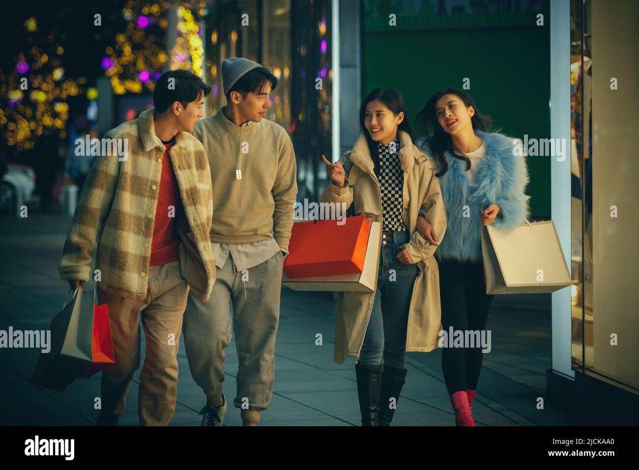 Happy fashionable young people go shopping Stock Photo - Alamy