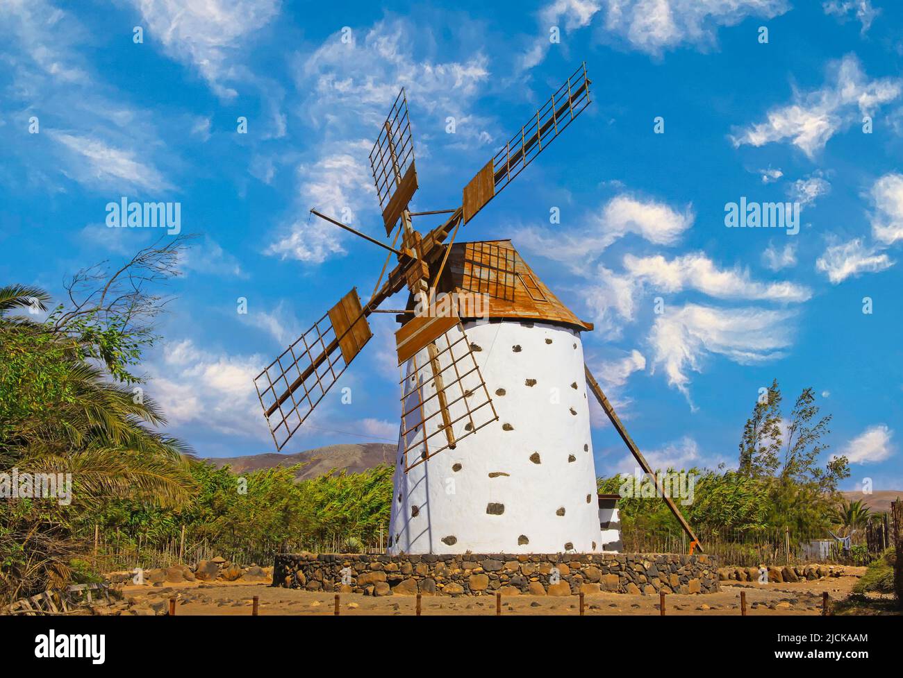 One beautiful spanish isolated ancient white traditional stone windmill ...