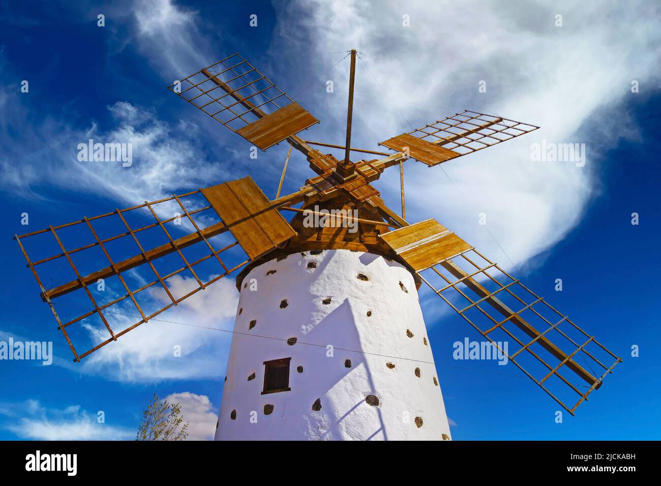 One beautiful spanish isolated ancient white traditional stone windmill ...
