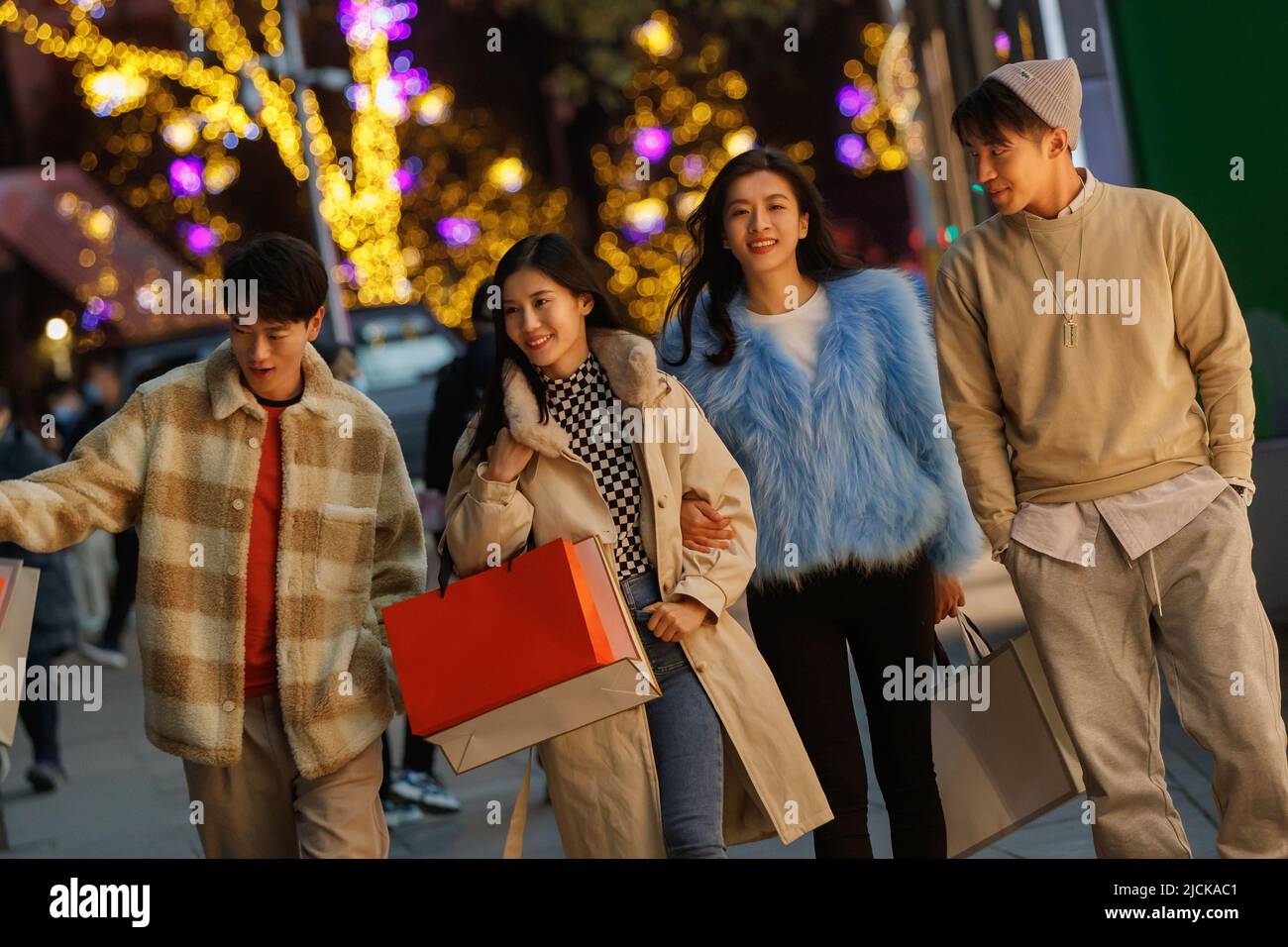 Young couple walking downtown night hi-res stock photography and images ...