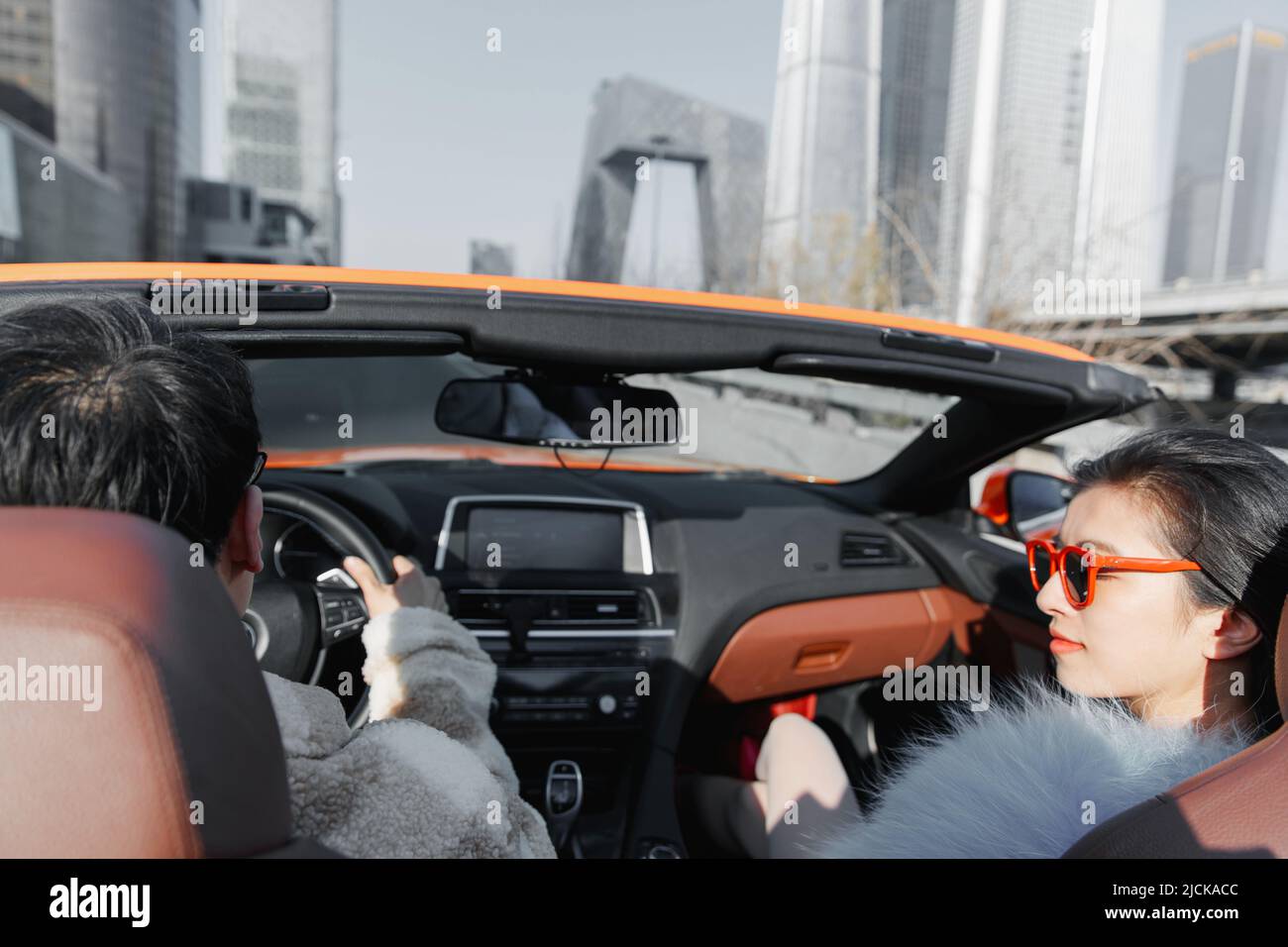 Fashionable young couples driving car for a ride Stock Photo - Alamy