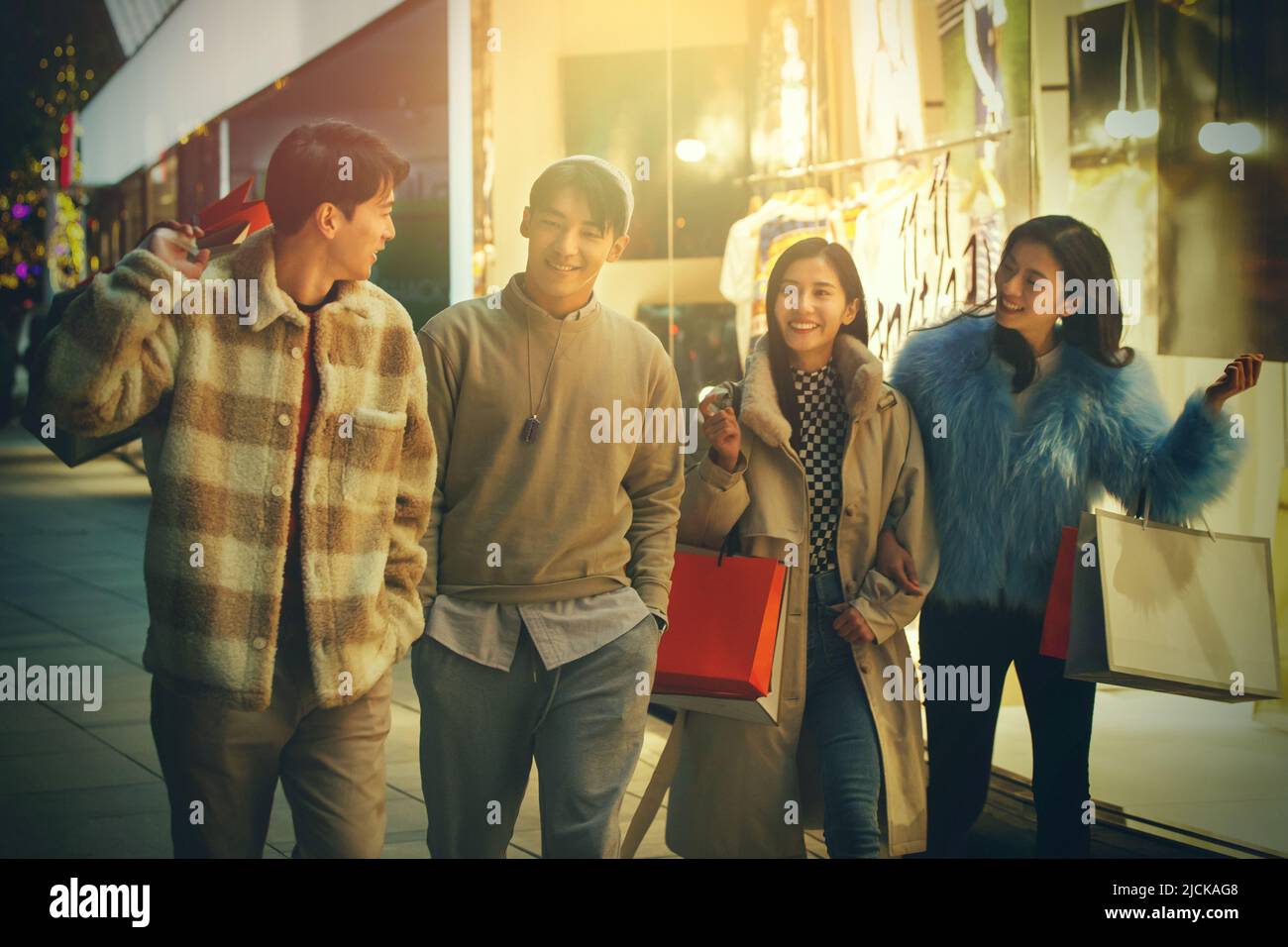 Happy fashionable young people go shopping Stock Photo - Alamy