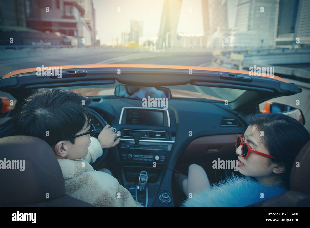 Fashionable young couples driving car for a ride Stock Photo - Alamy