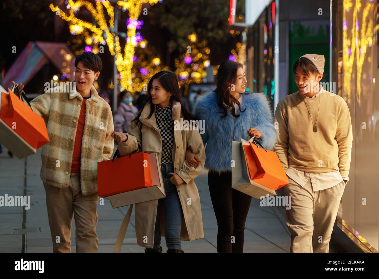 Young couple walking downtown night hi-res stock photography and images ...