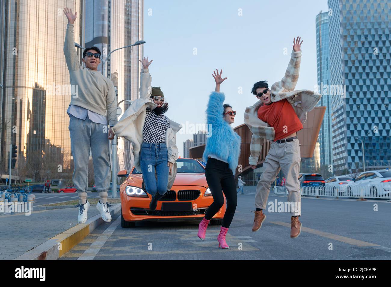 Excited young chinese friends hi-res stock photography and images - Alamy
