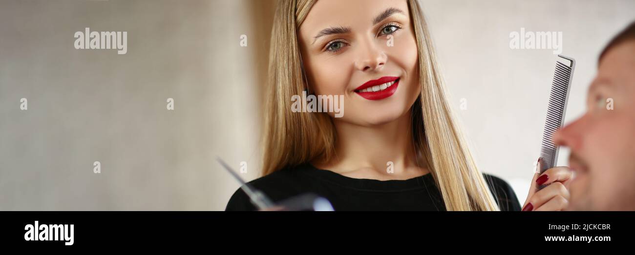 Young pretty professional master holding tools for work and posing ...