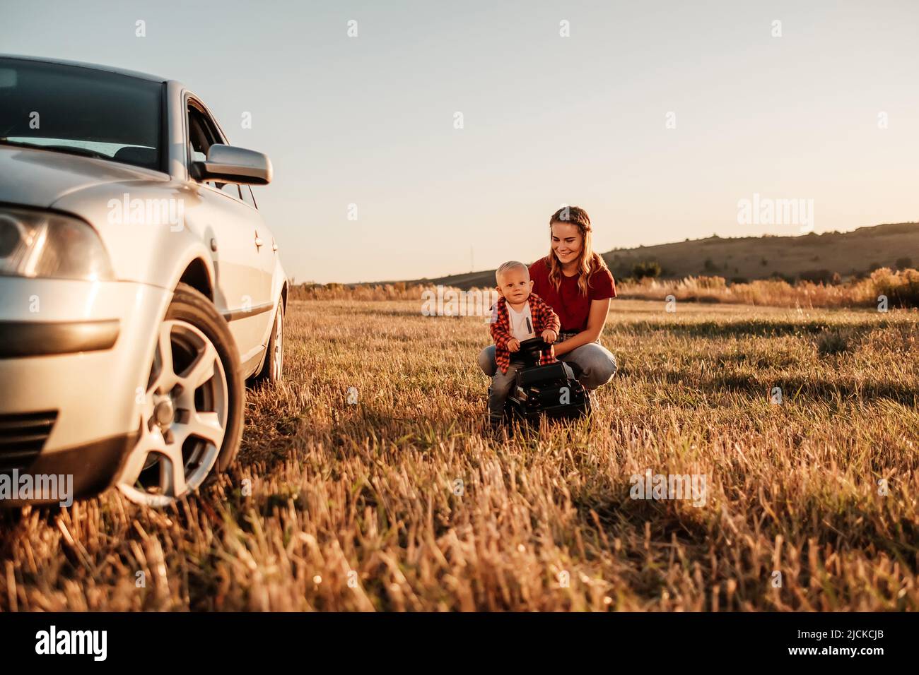 Happy Mom with Her Little Son Enjoying Summer Weekend Outside the City ...
