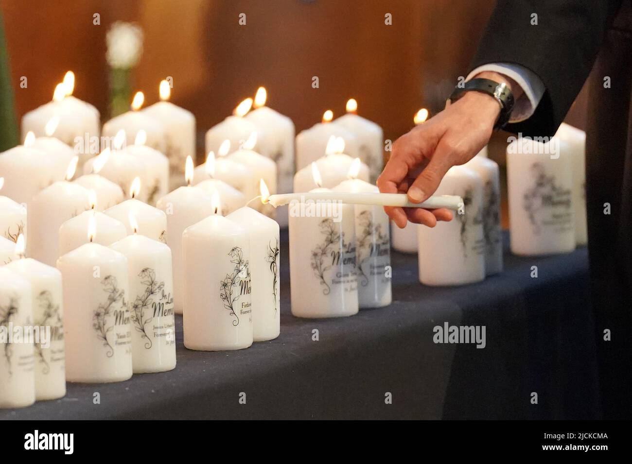 Candles with the names of the victims are lit during the Grenfell fire ...