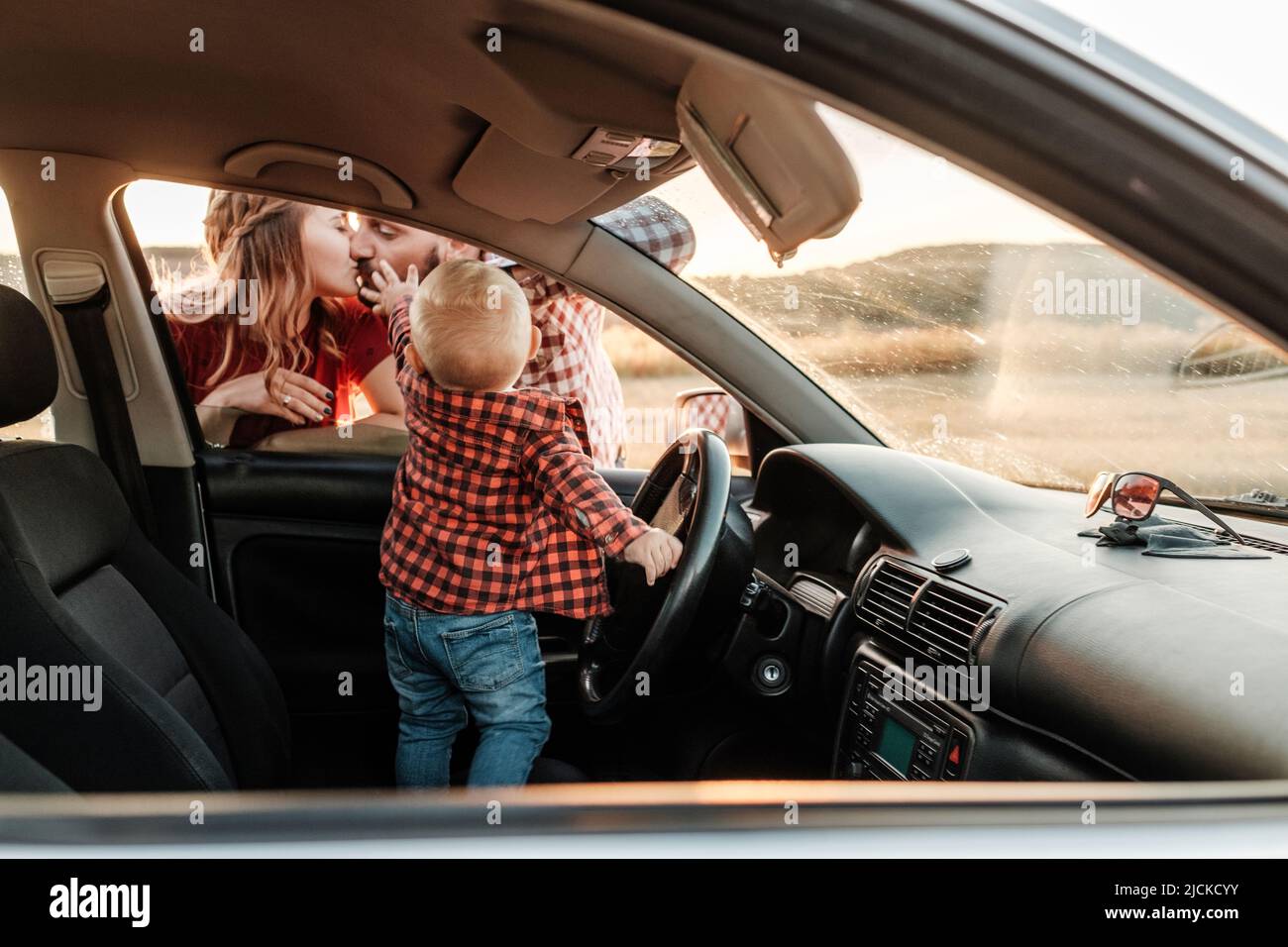 Happy Young Family Mom and Dad with Their Son Little Driver Enjoying ...